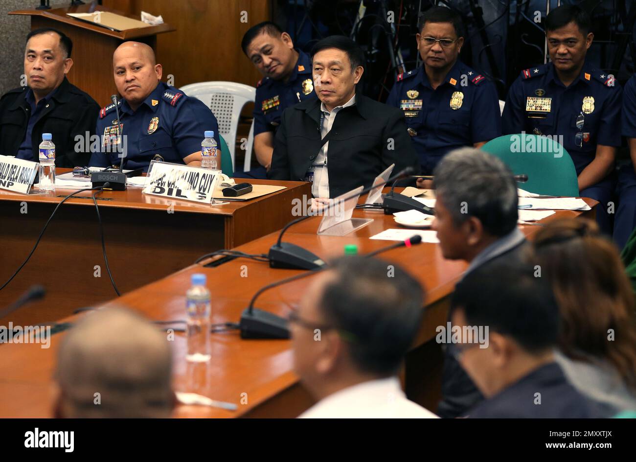 Philippine Police Chief Ronald Dela Rosa, second from left, looks at ...