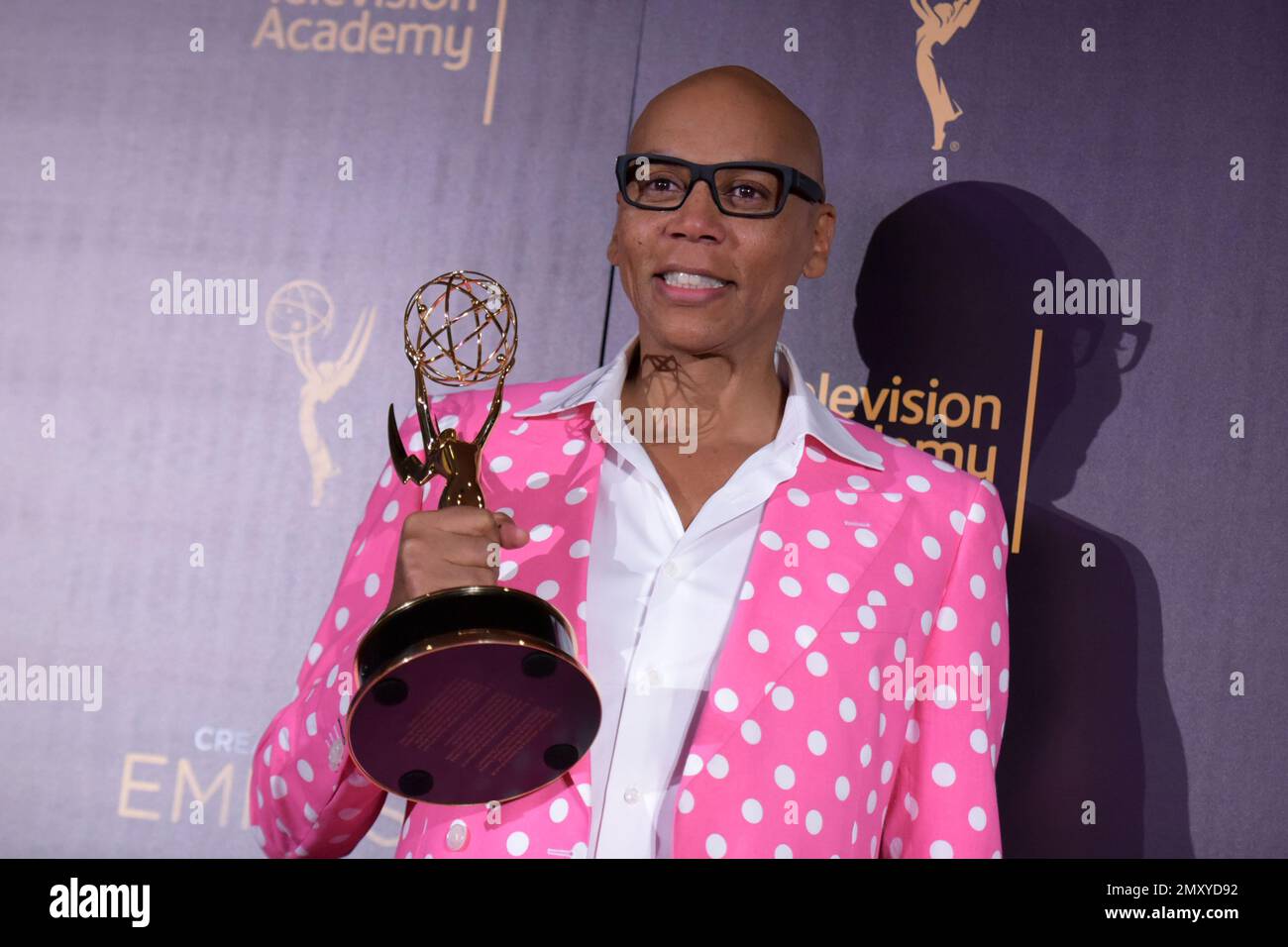 RuPaul Charles poses with the award for outstanding host for a reality ...