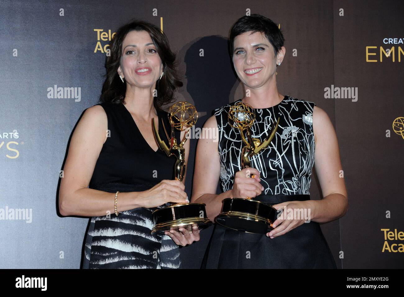 Laura Ricciardi, left, and Moira Demos pose in the press room with the ...