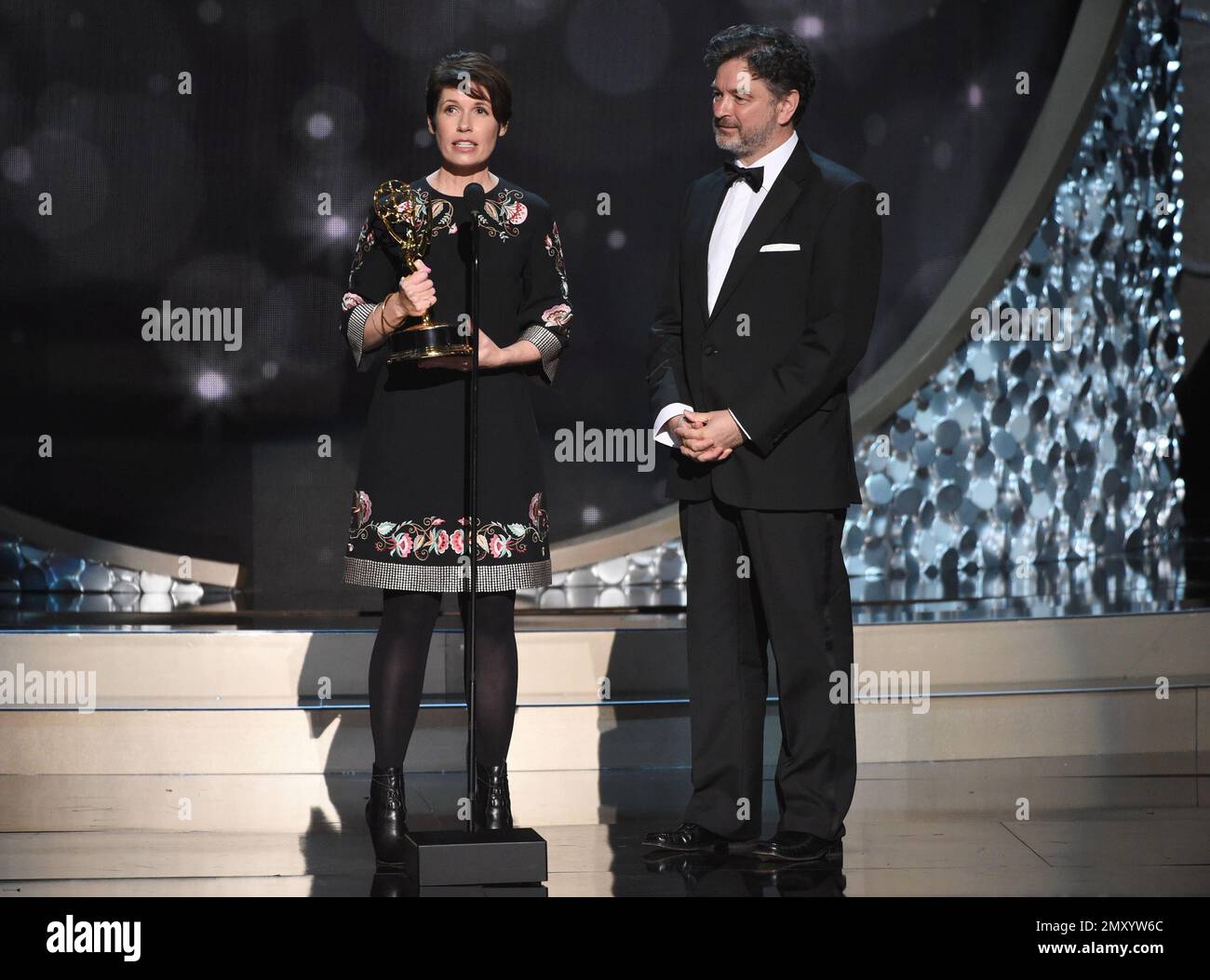 EXCLUSIVE - Deborah Riley, left, and Rob Cameron accept the award for ...