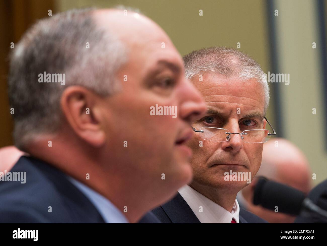 FEMA Regional Administrator Tony Robinson listens at right as Louisiana ...