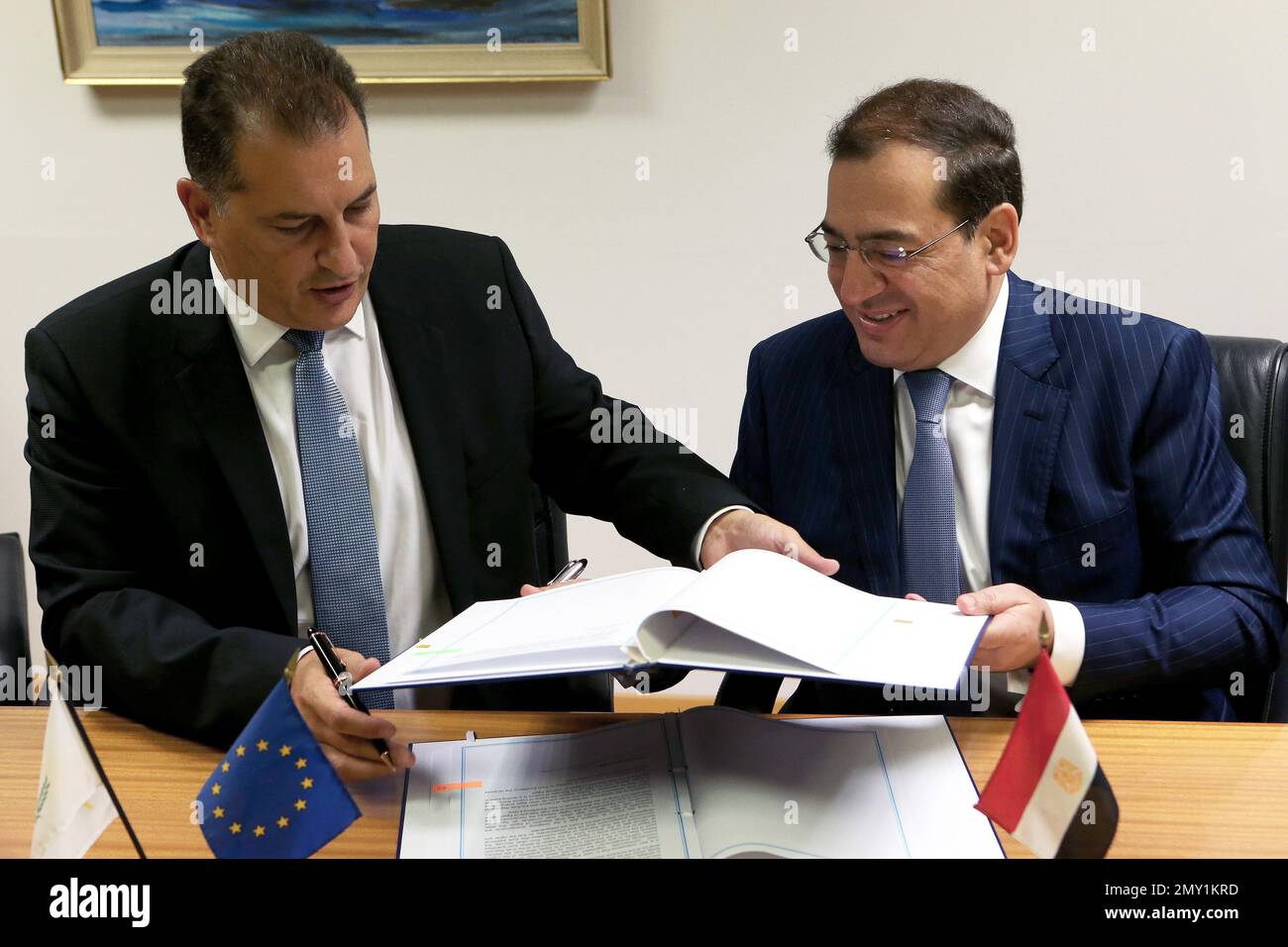 Cyprus' Energy Minister Yiorgos Lakkotrypis, left, and Egypt's ...