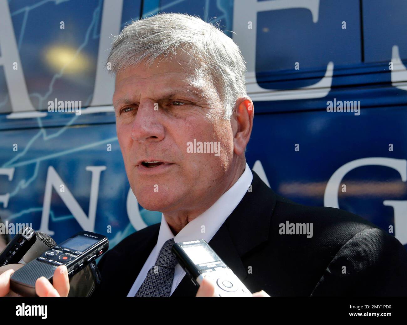 Evangelist Franklin Graham speaks to media in front of his bus after a ...