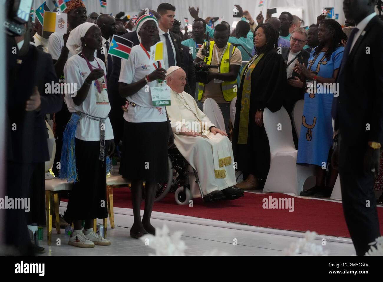 Faithful cheer as Pope Francis arrives for a meeting with internally ...