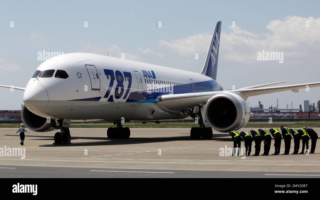 FILE - In this April 28, 2013 file photo, ground crewmen bow as a ...