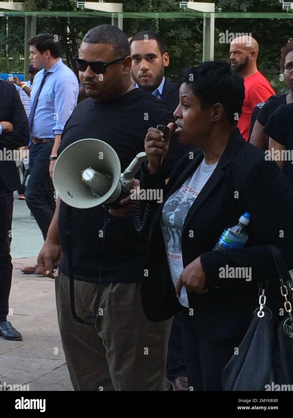 Kim Cole speaks during a demonstration at Main Street Garden Park in ...
