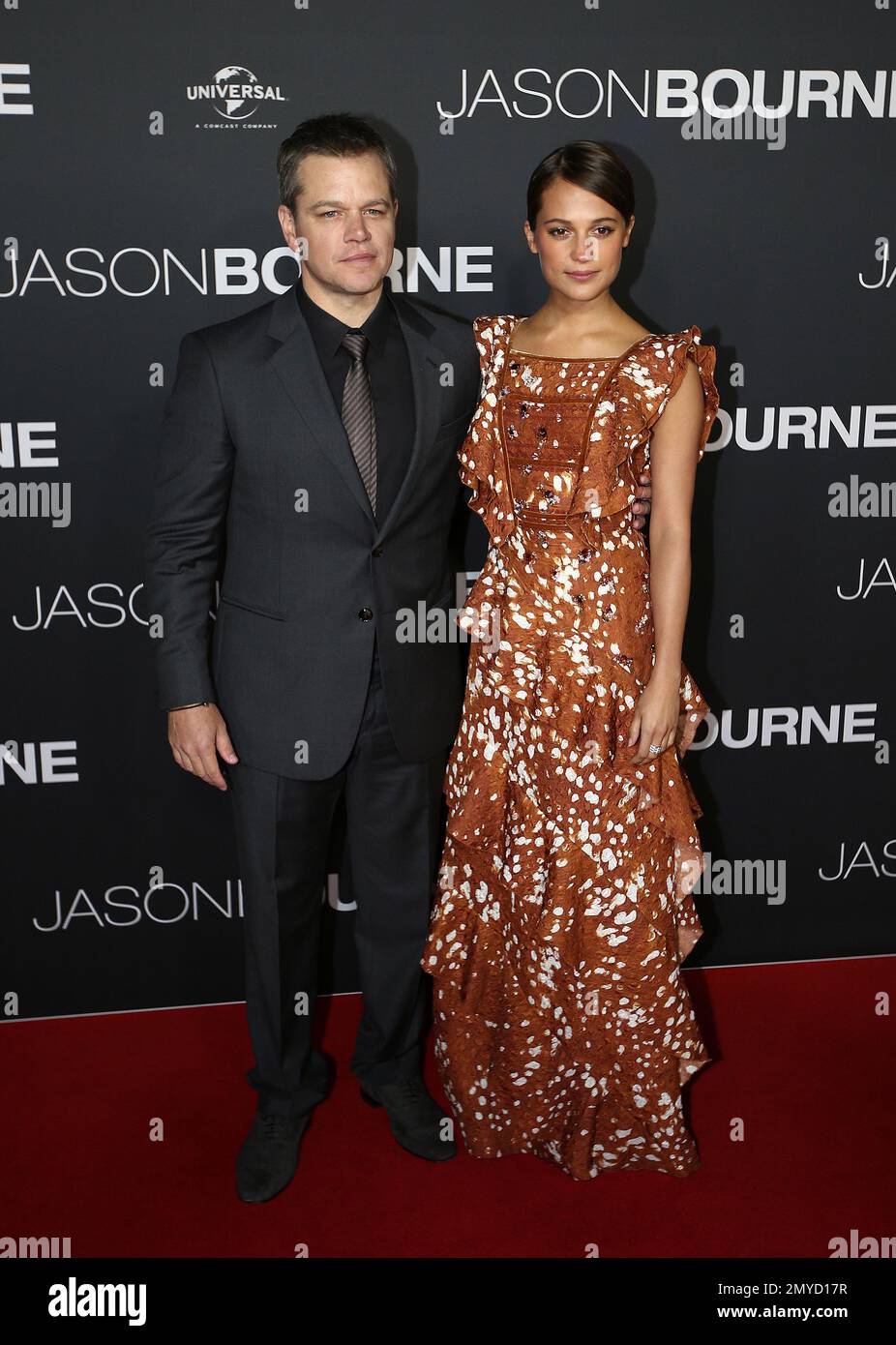 Matt Damon, left, and co-star Alicia Vikander pose for a photo as they ...