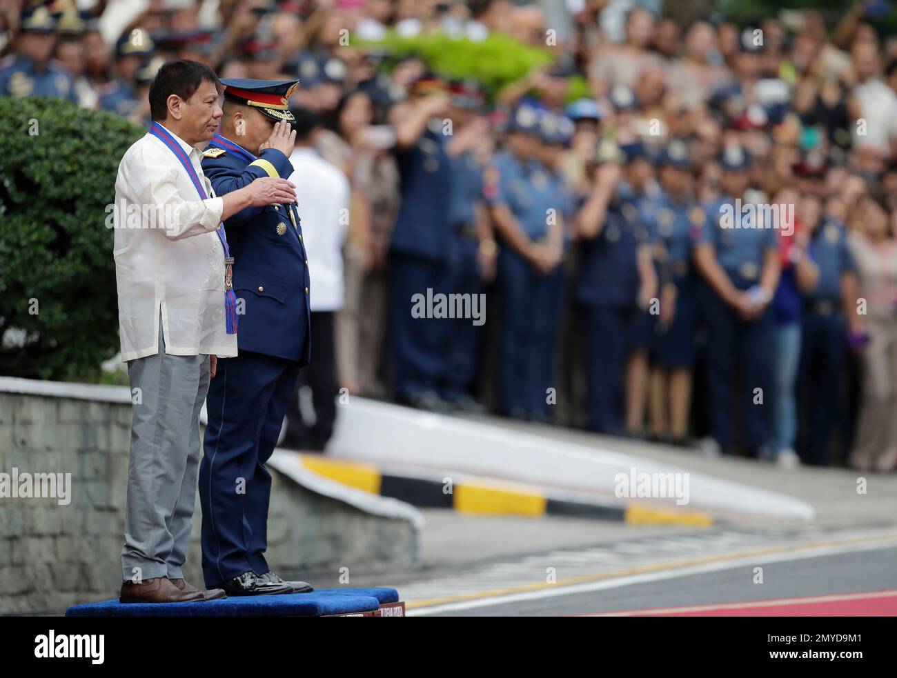 Philippine President Rodrigo Duterte, left, stands beside new Police ...
