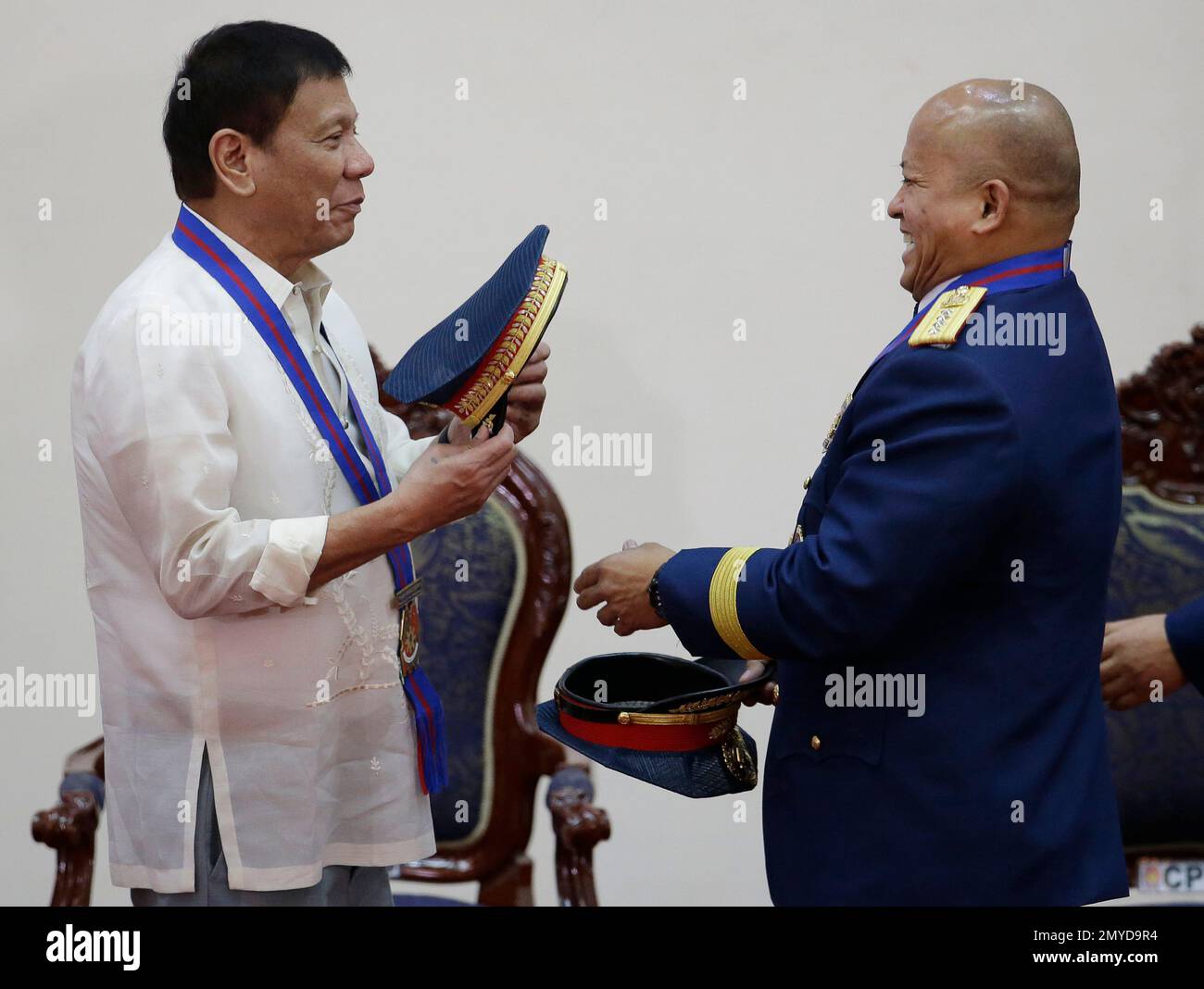 Philippine President Rodrigo Duterte, left, smiles with new Police ...