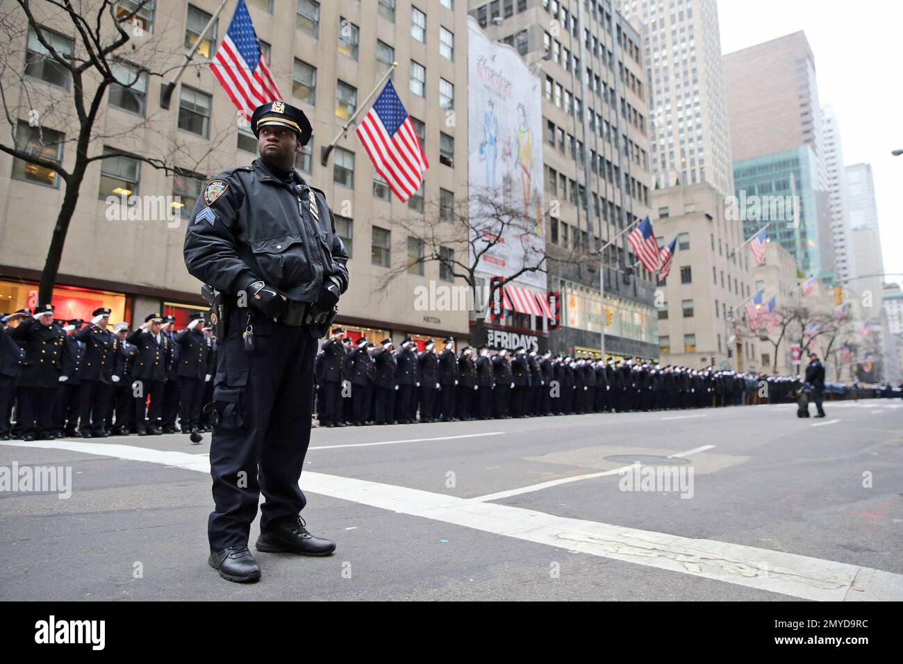 FILE - In this Dec. 30, 2015 file photo, police officers line New York ...