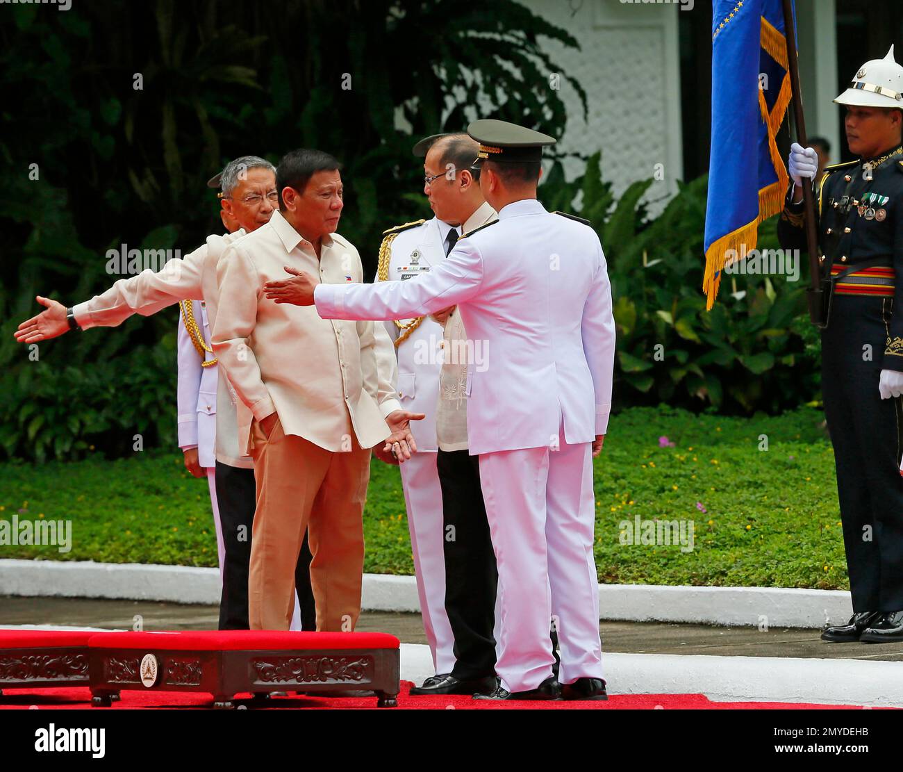New Philippine President Rodrigo Duterte, second from left, talks with ...