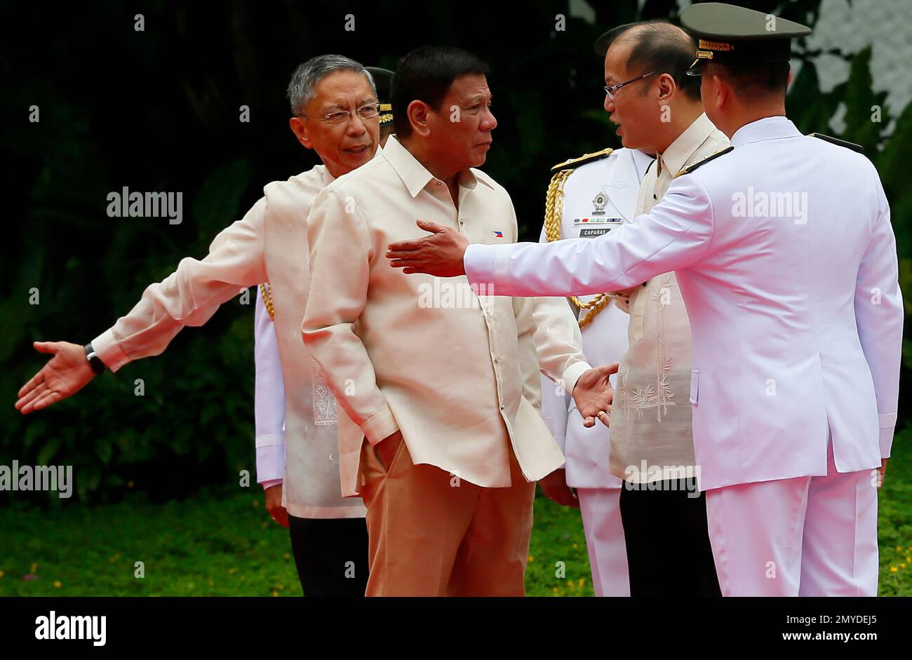 New Philippine President Rodrigo Duterte, second from left, talks with ...