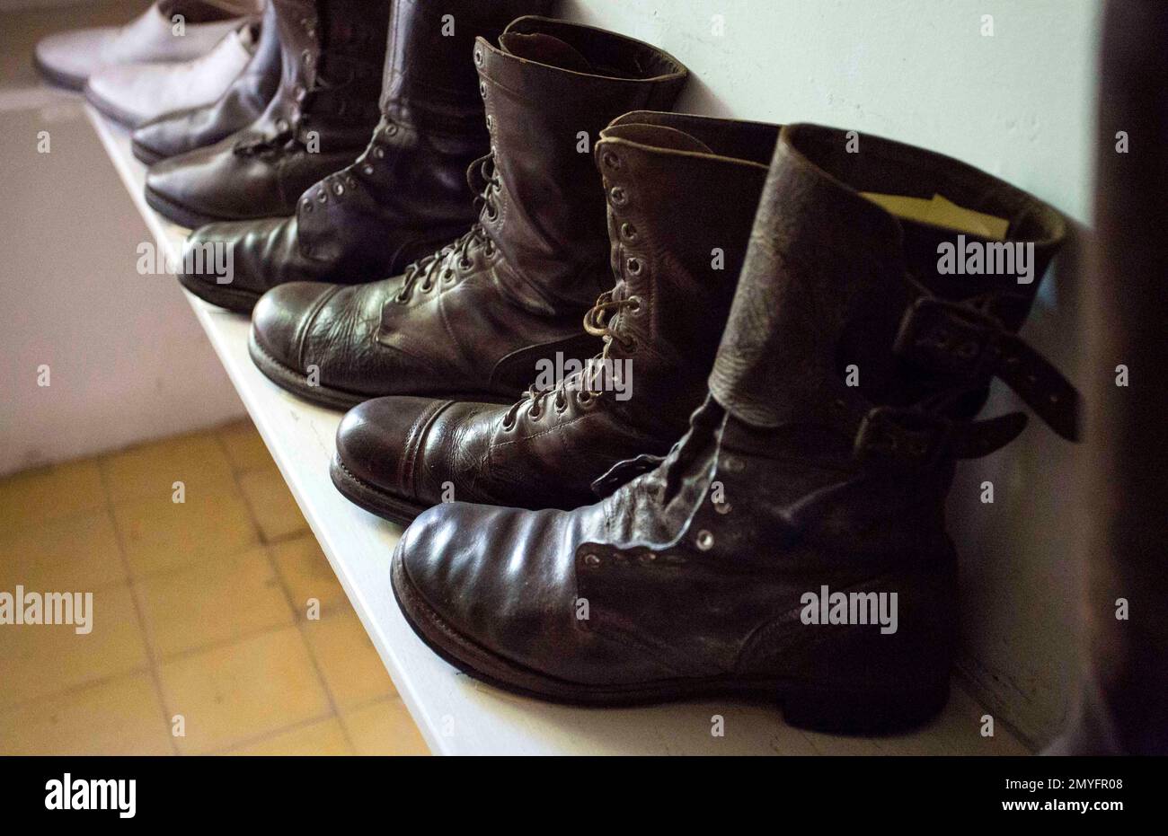 Boots once worn by Ernest Hemingway stand lined up in a dressing room ...