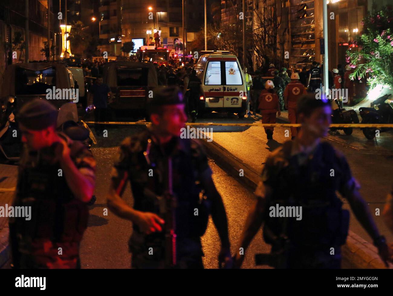 Lebanese army soldiers block the road at the site where a bomb was ...