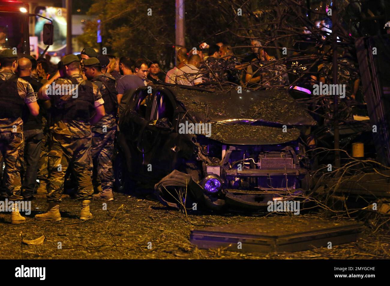 Lebanese army and citizens gather at the site where a bomb was placed ...