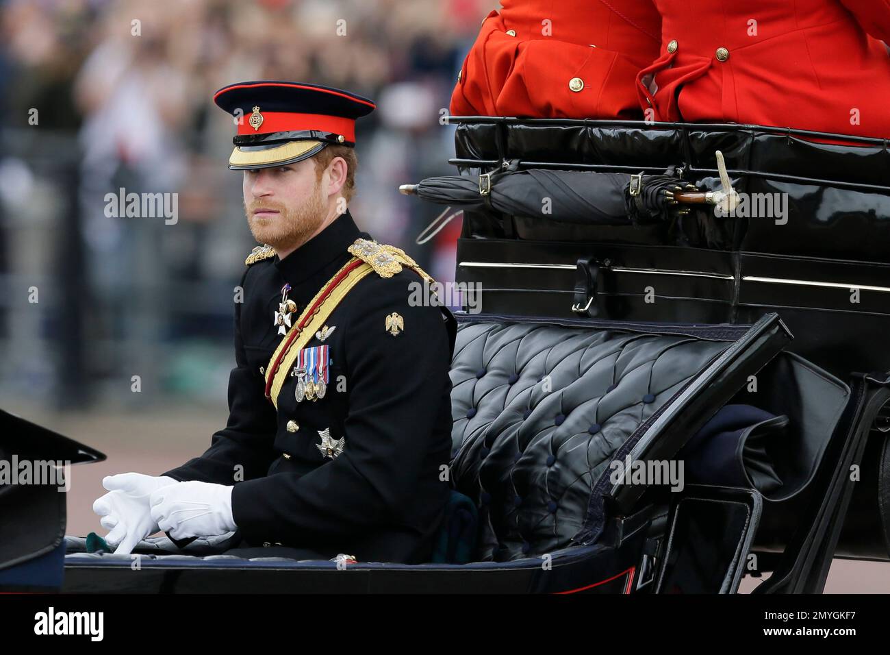 Britain's Britain's Prince Harry rides in a carriage during the ...