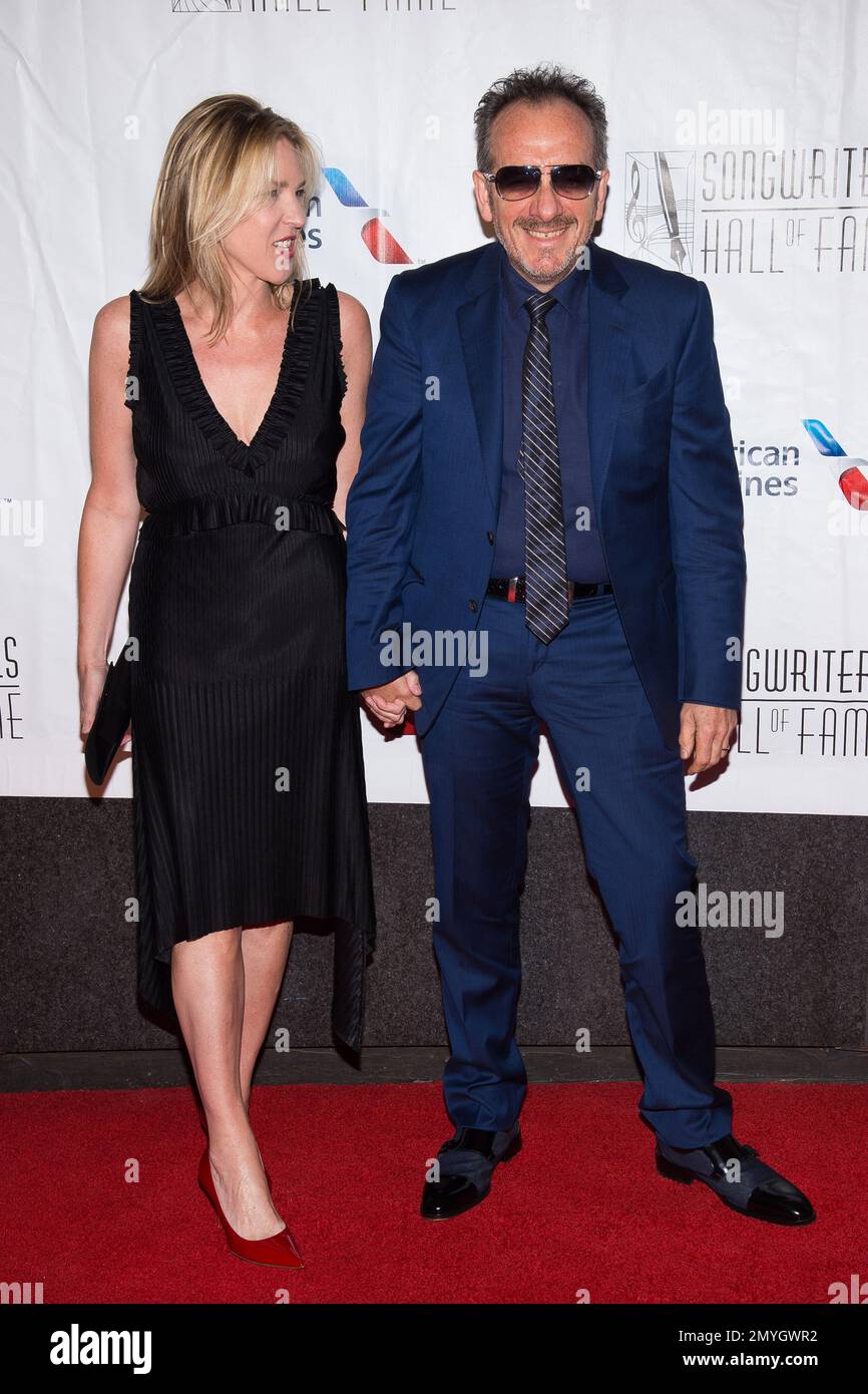 Inductee Elvis Costello, right, and his wife Diana Krall attend the ...