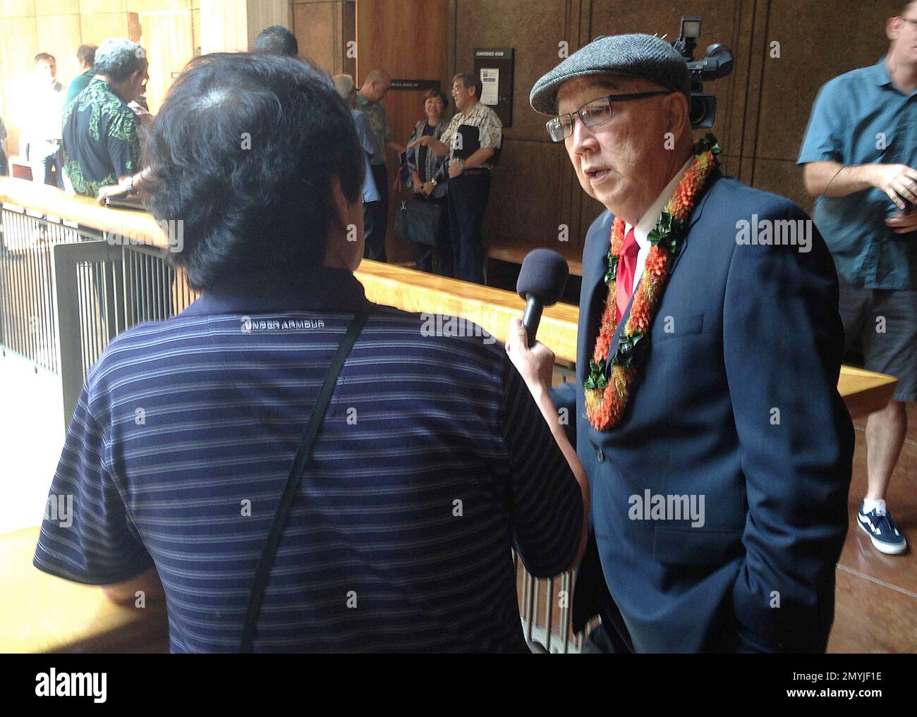 FILE - In this Feb. 17, 2015, file photo, Randall Iwase, right, talks ...
