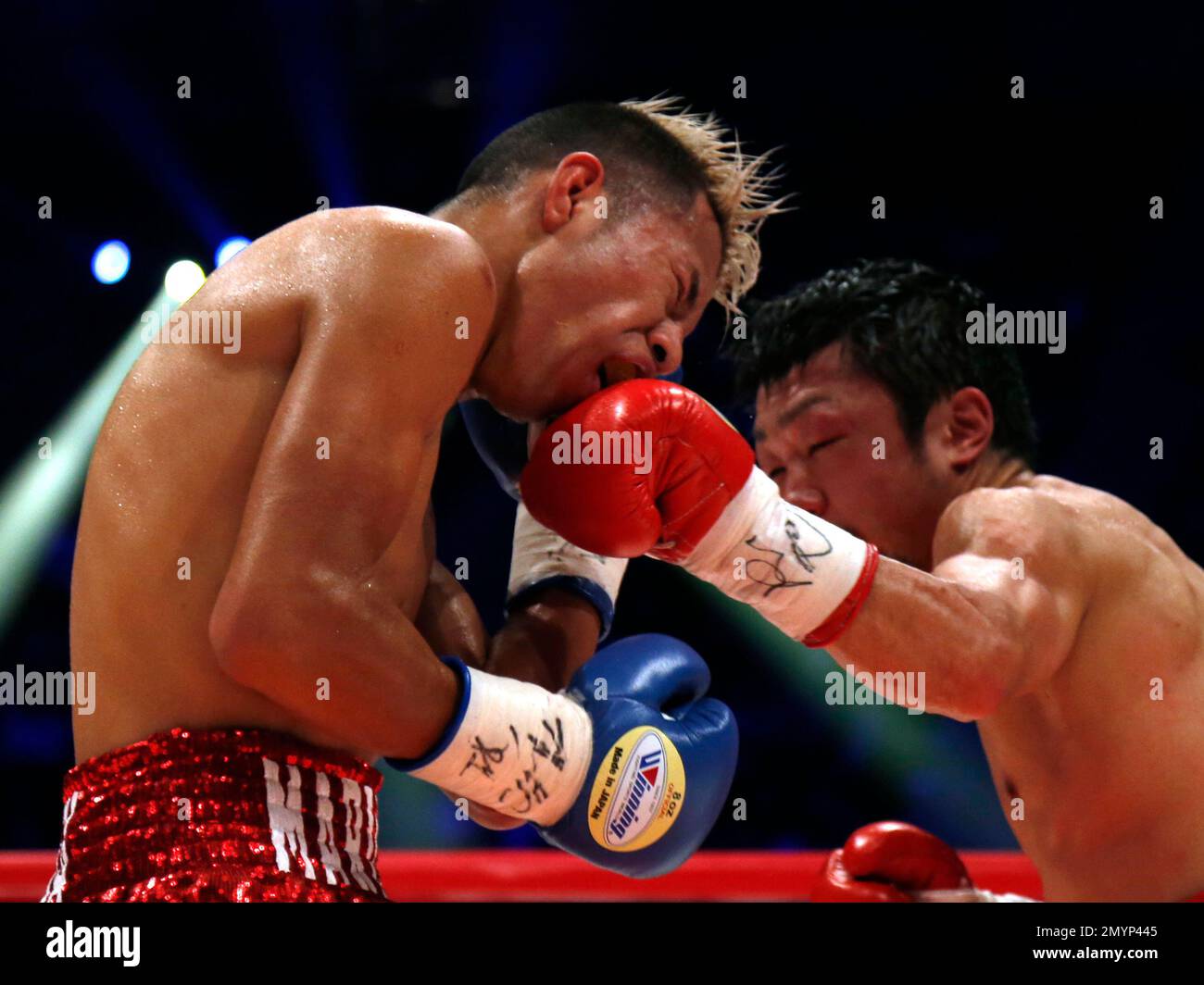 Japanese champion Akira Yaegashi, right, lands a left on the face of ...