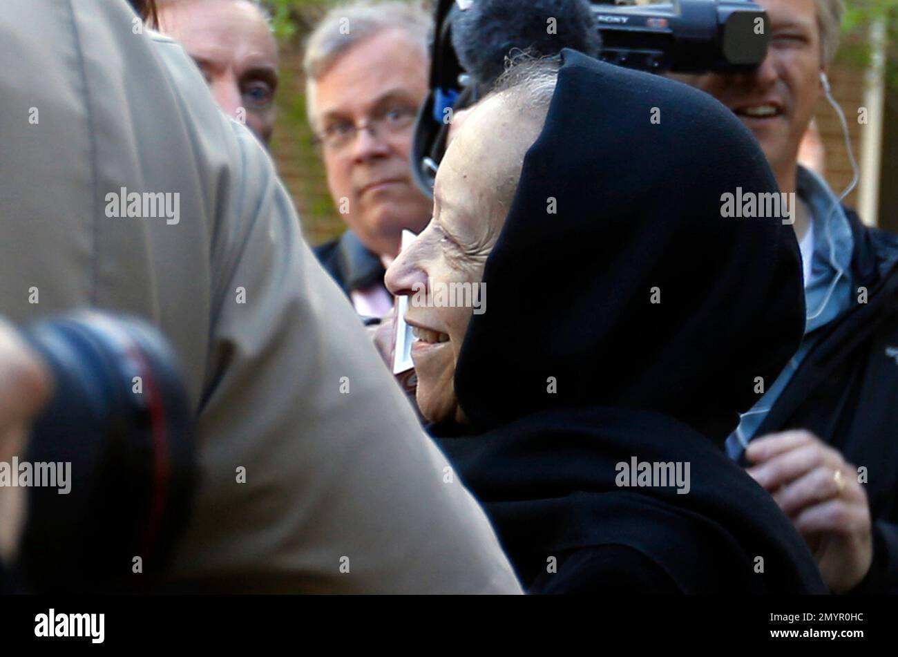 Noreen Nelson, center, the half-sister of Prince, makes her way through ...