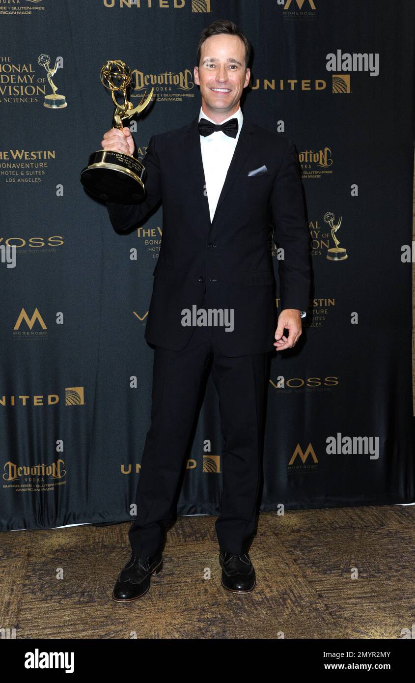 Mike Richards poses in the press room with the award for outstanding ...
