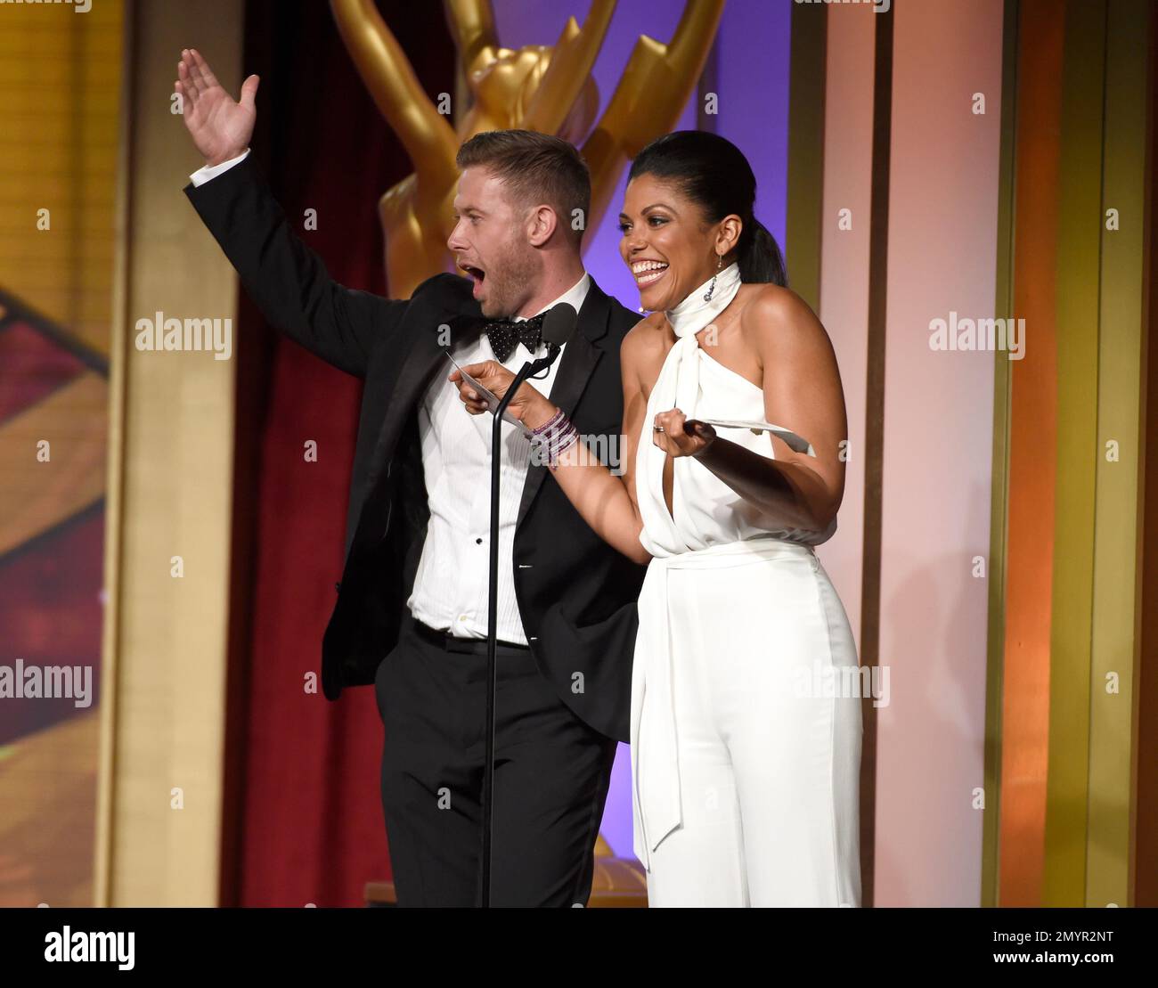 Jacob Young, left, and Karla Mosley present the award for outstanding ...