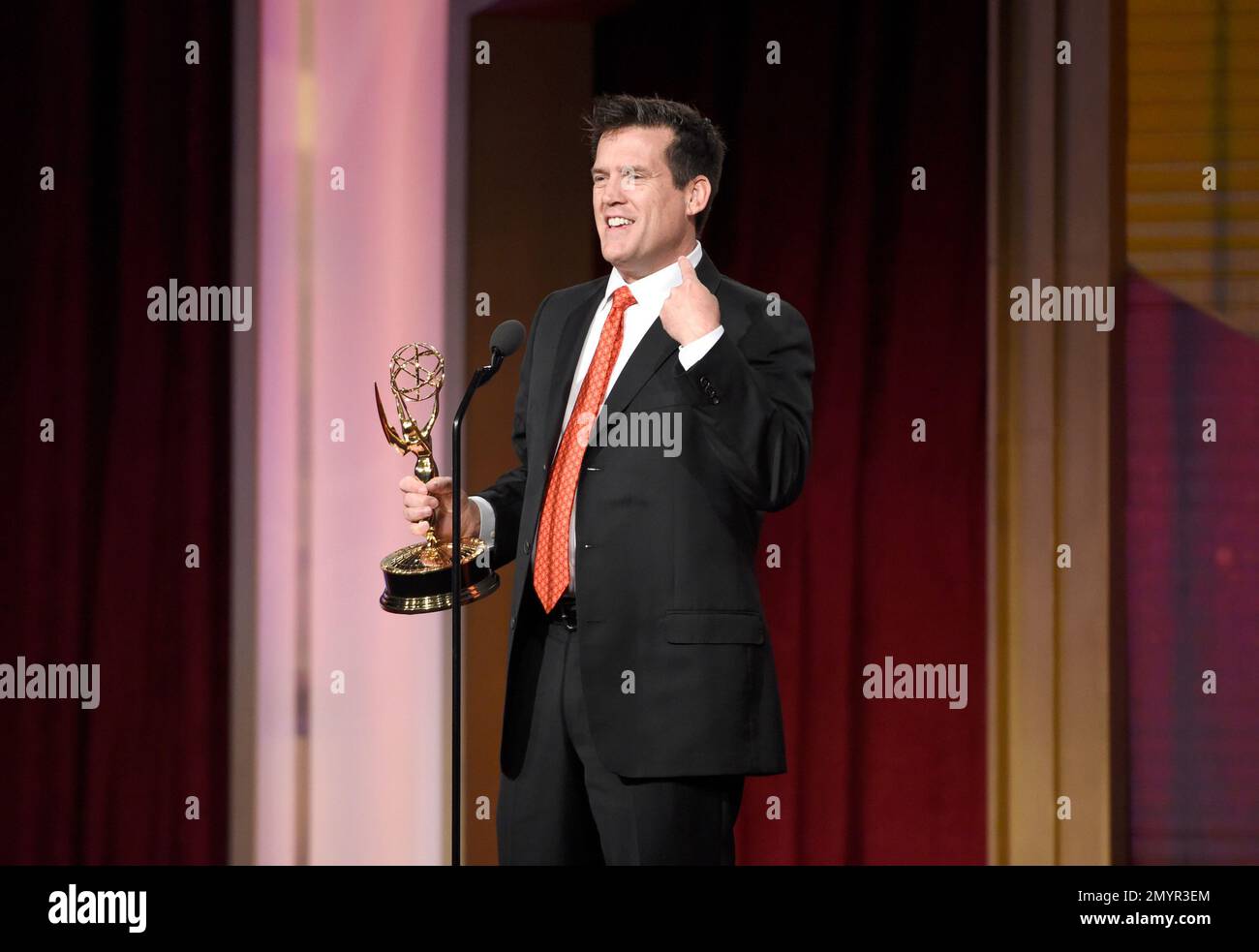 Scott St. John accepts the award for outstanding game show host for ...