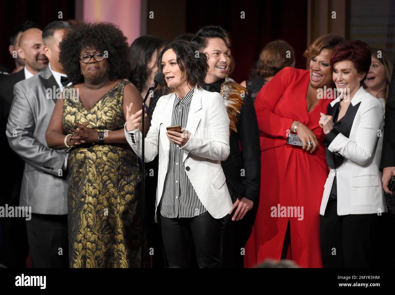 Sara Gilbert, center, with cast and crew from "The Talk", accepts the ...