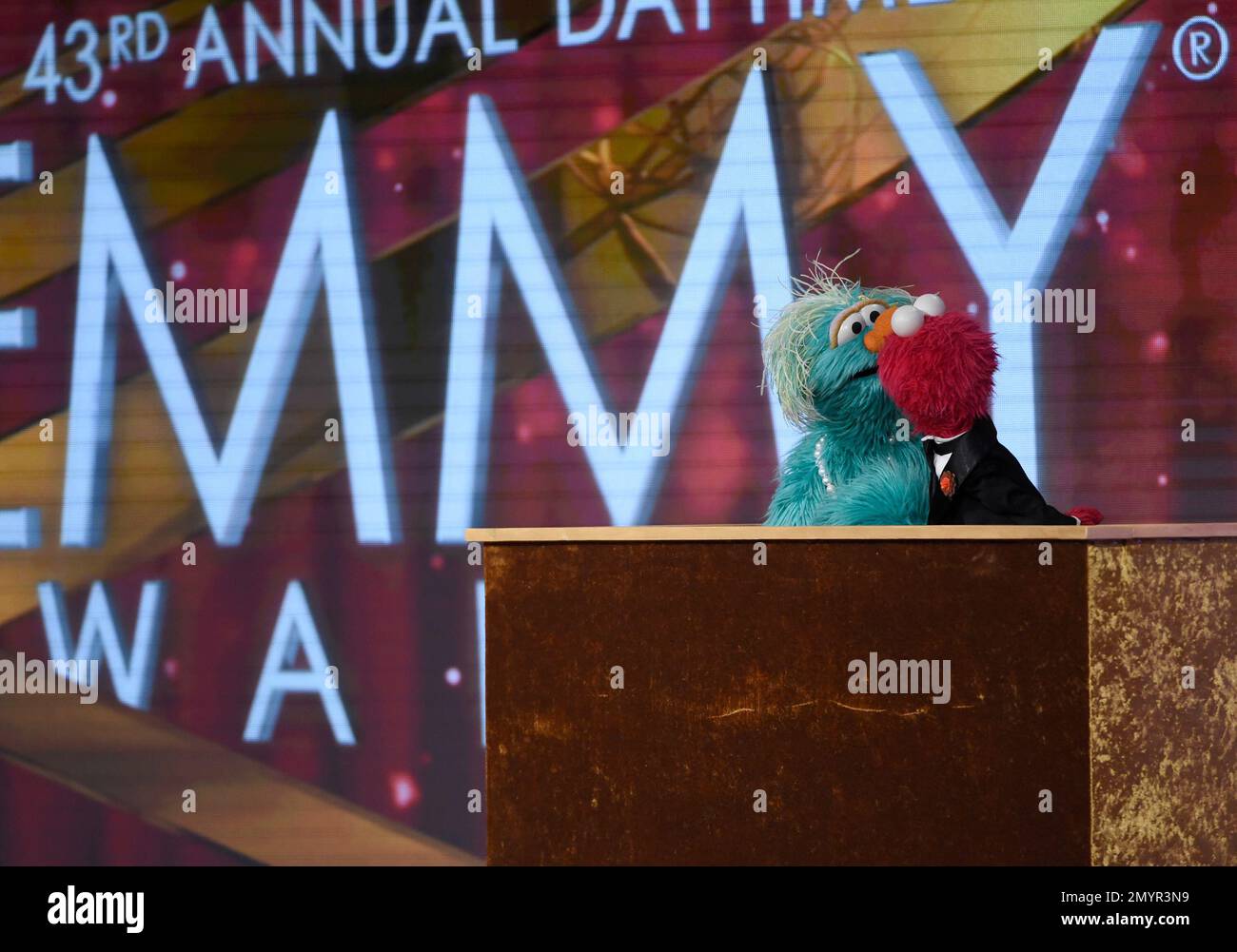 Rosita, left, and Elmo present the award for outstanding supporting ...