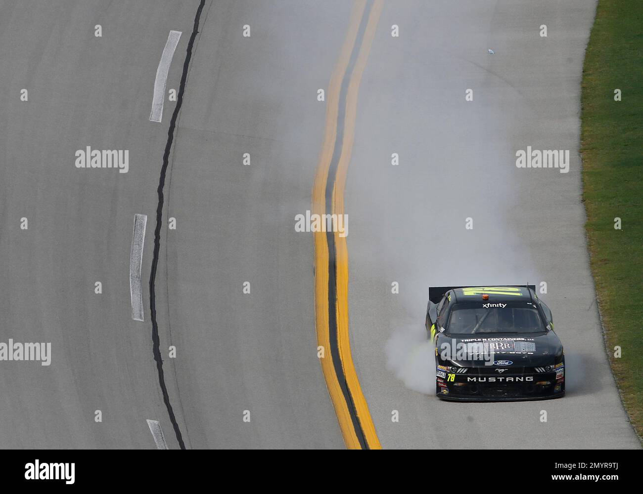 NASCAR Xfinity Series driver B.J. McLeod rounds the fourth turn with ...