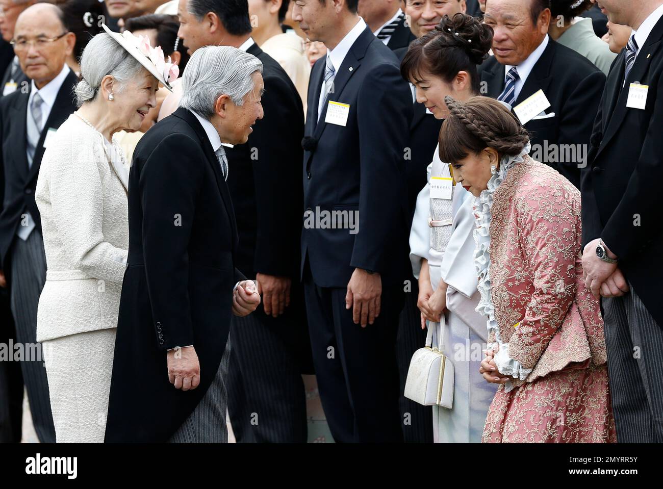 Japan's Emperor Akihito, second left, and Empress Michiko, left, talk ...
