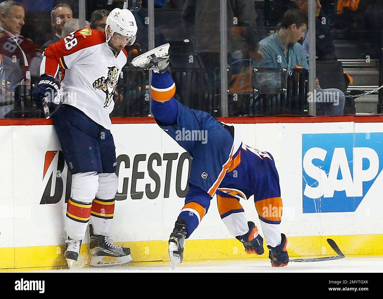 Florida Panthers left wing Garrett Wilson (28) hits the boards as New ...