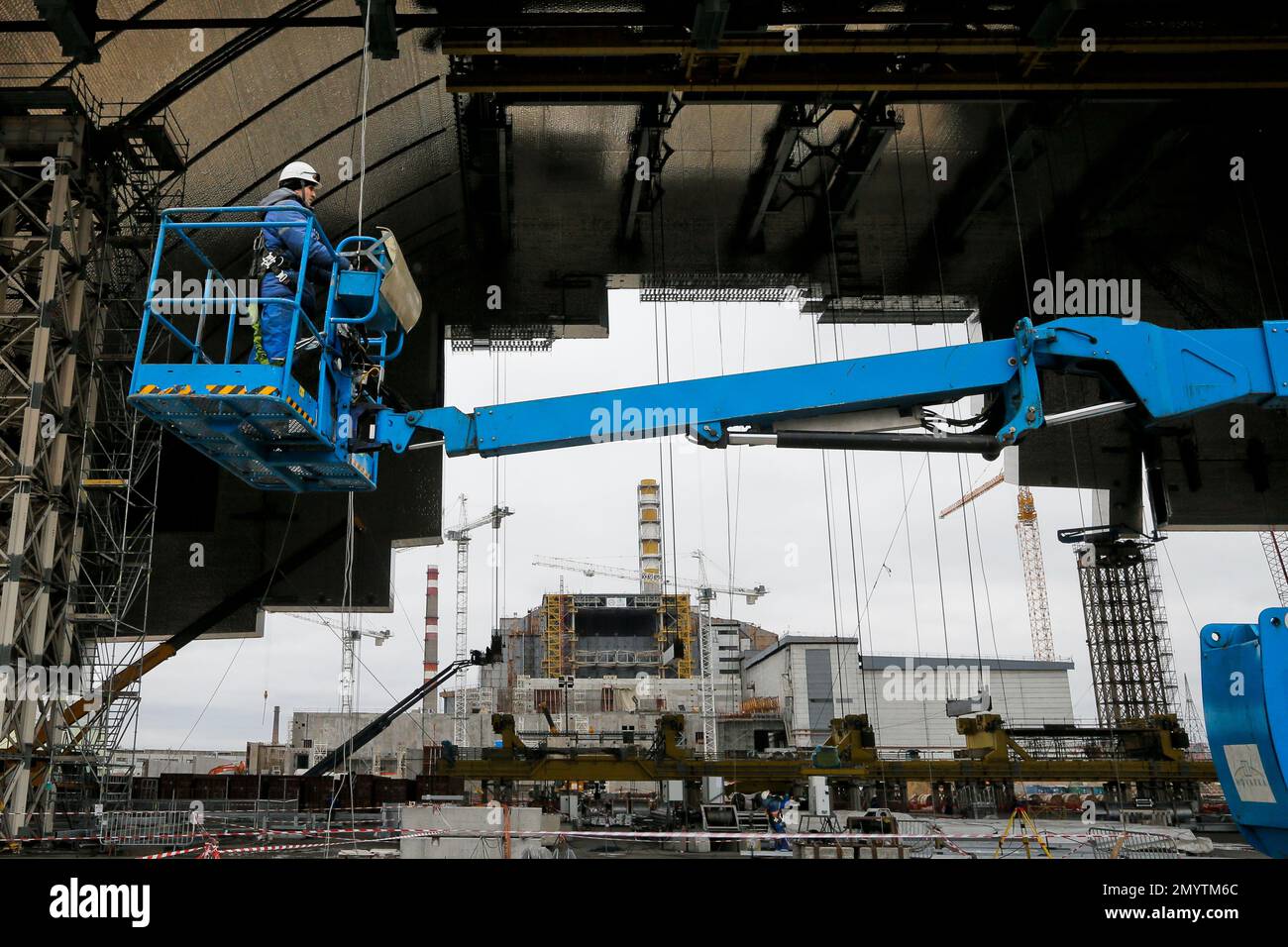 In this photo taken Wednesday, March 23, 2016 workers build an arch ...