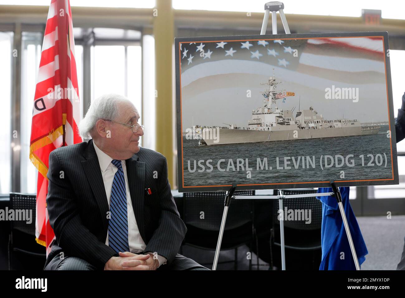 Former U.S. Sen. Carl Levin watches during the unveiling of a photo of ...