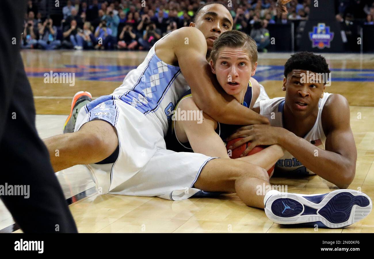 Notre Dame's Rex Pflueger, center, and North Carolina's Brice Johnson ...