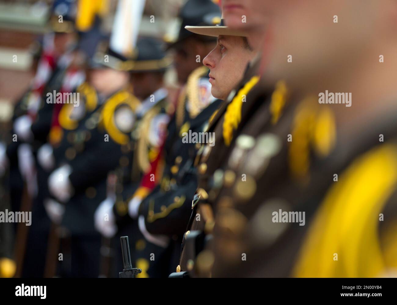 A Maryland police honor guard stand at attention before the arrival of ...