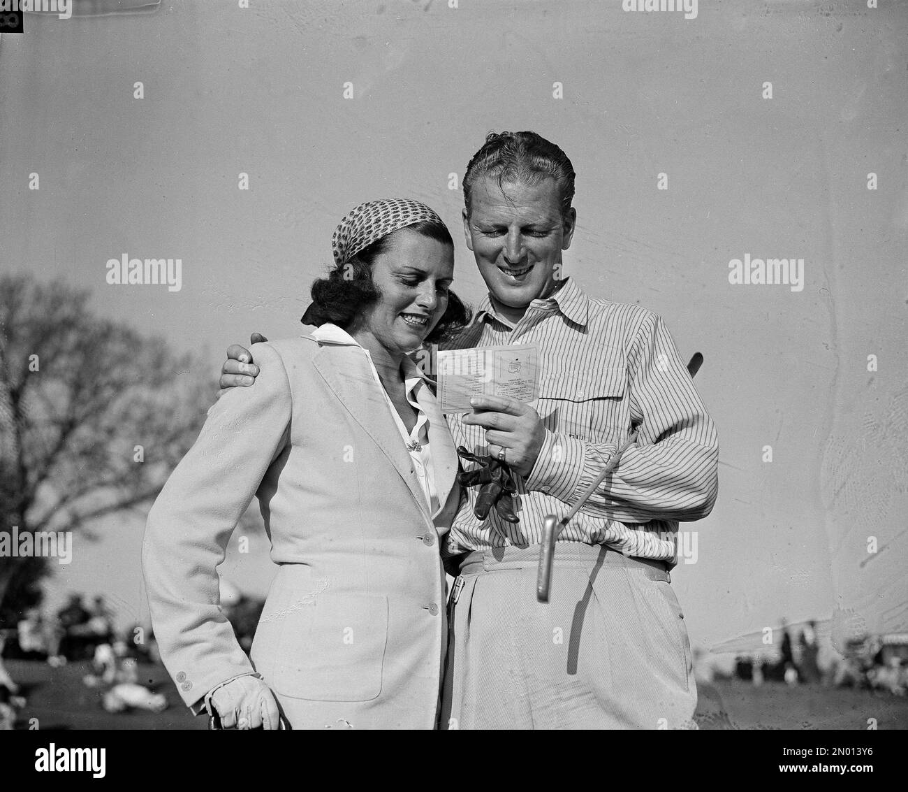 Craig Wood and his wife were all smiles as they admire his score card ...