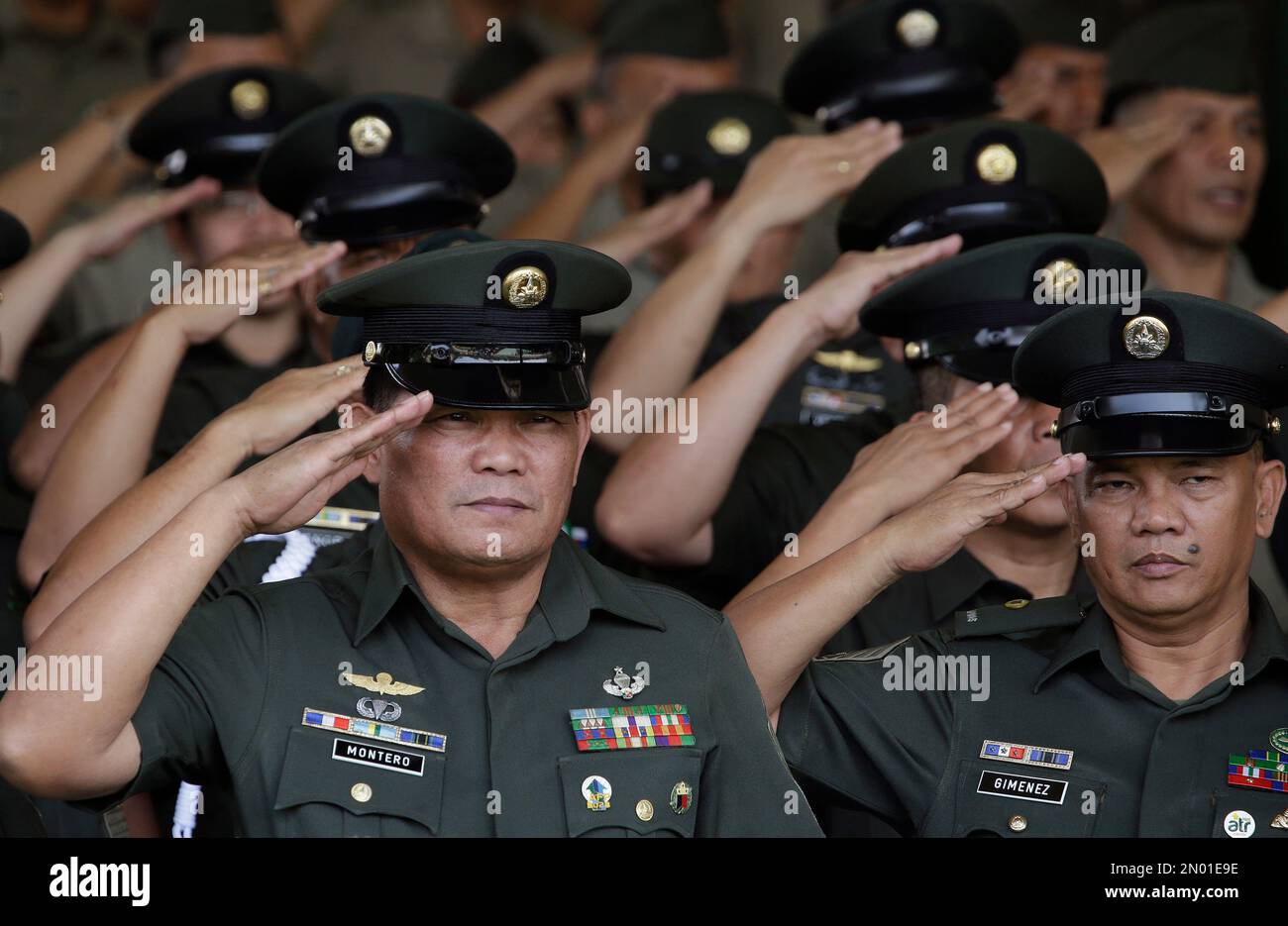Philippine Army officers salute during ceremonies at the 119th founding ...