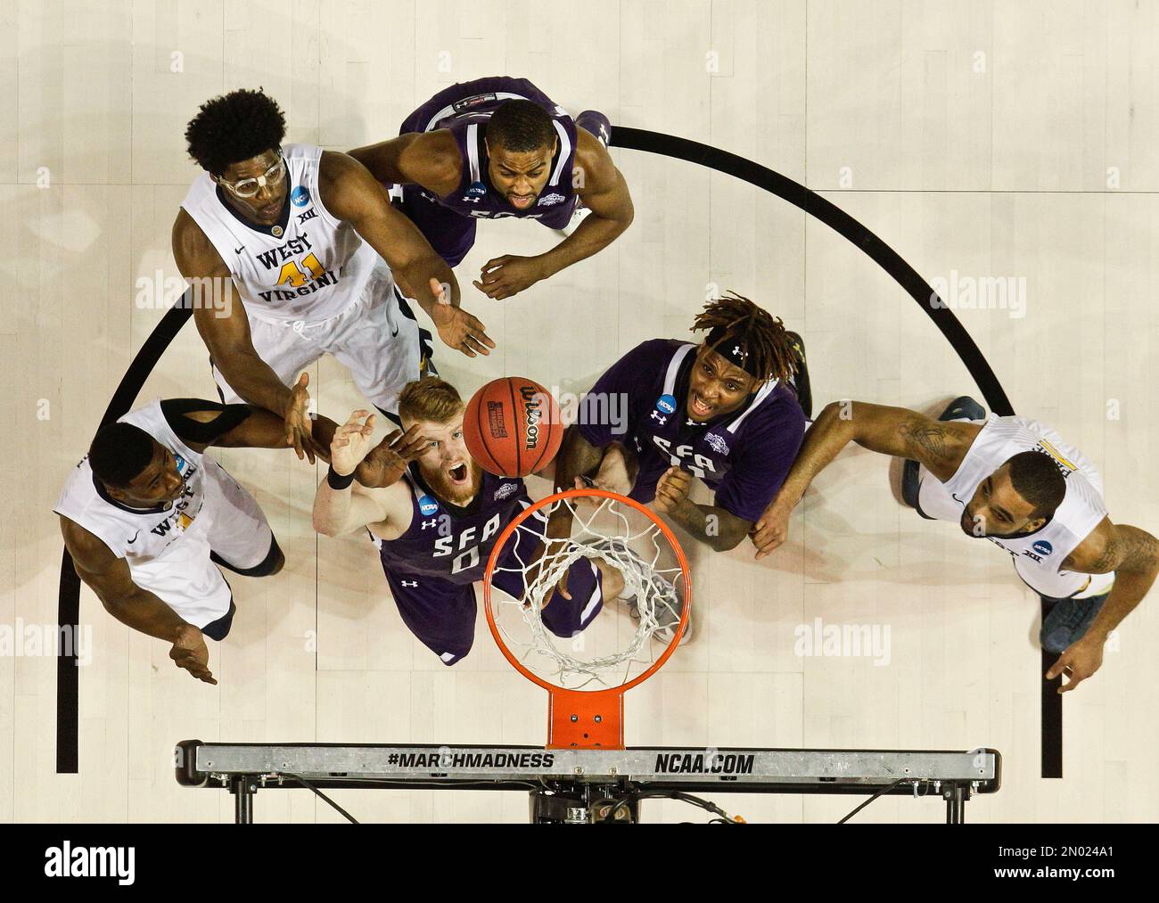 Stephen F. Austin's Thomas Walkup (0) and Clide Geffrard, Jr. (11 ...