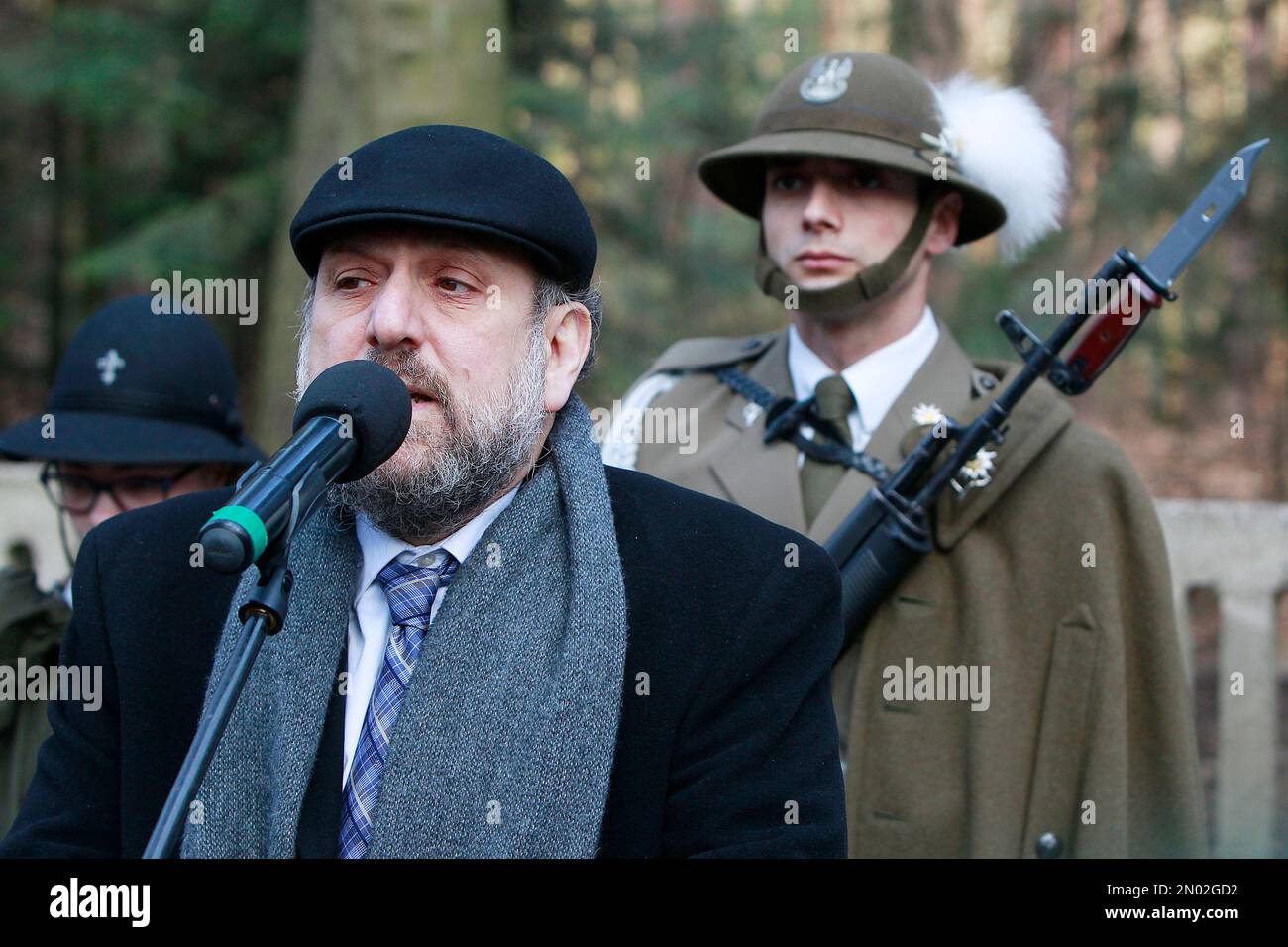 Chief Rabi of Poland, Michael Schudrich, says prayers for the dead at a ...