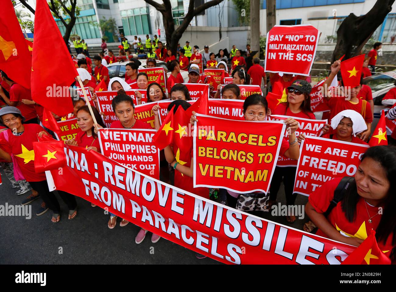 Filipinos, together with Vietnamese expatriates display placards during ...