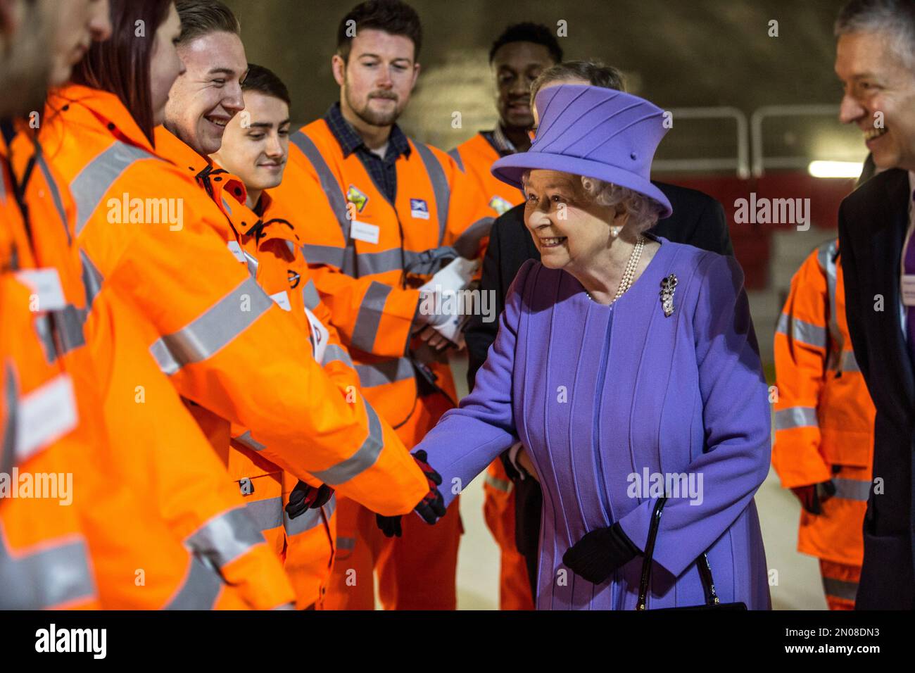 Britain's Queen Elizabeth II talks to Crossrail workers after she ...