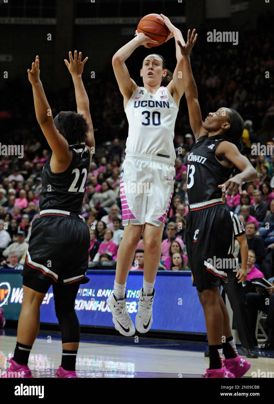 Connecticut’s Breanna Stewart, center, shoots over Cincinnati’s Bianca ...