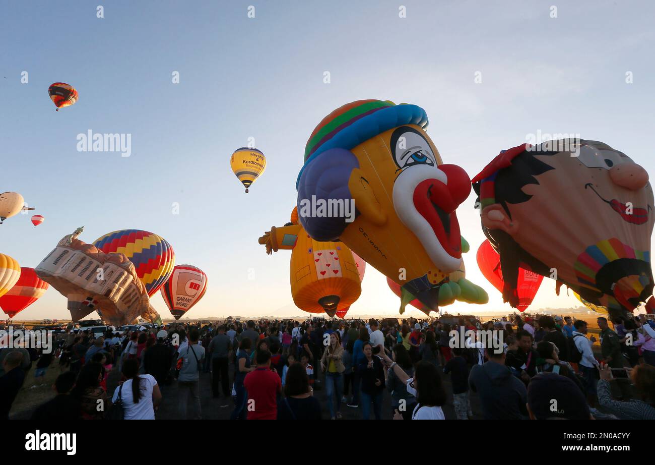 Colorful hot air balloons from twelve countries take off during the ...