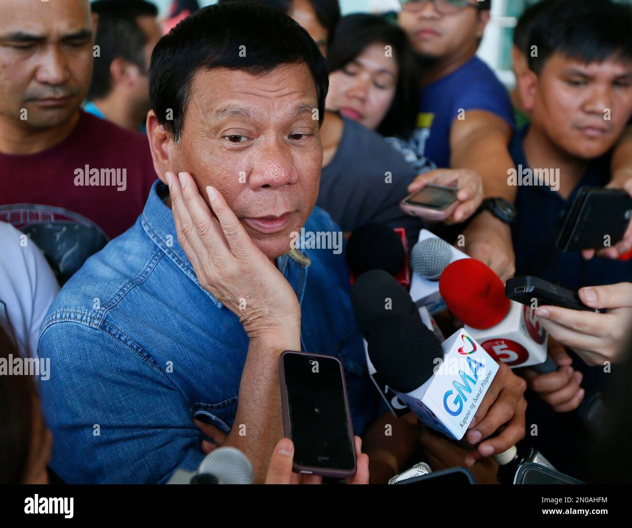 Philippine presidential candidate Rodrigo Duterte talks to the media ...