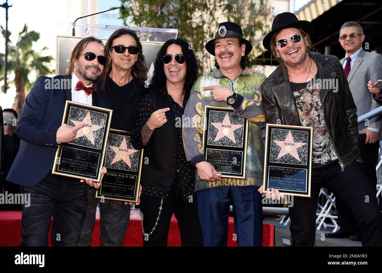 Guitarist Carlos Santana, second from right, poses with Mana members ...