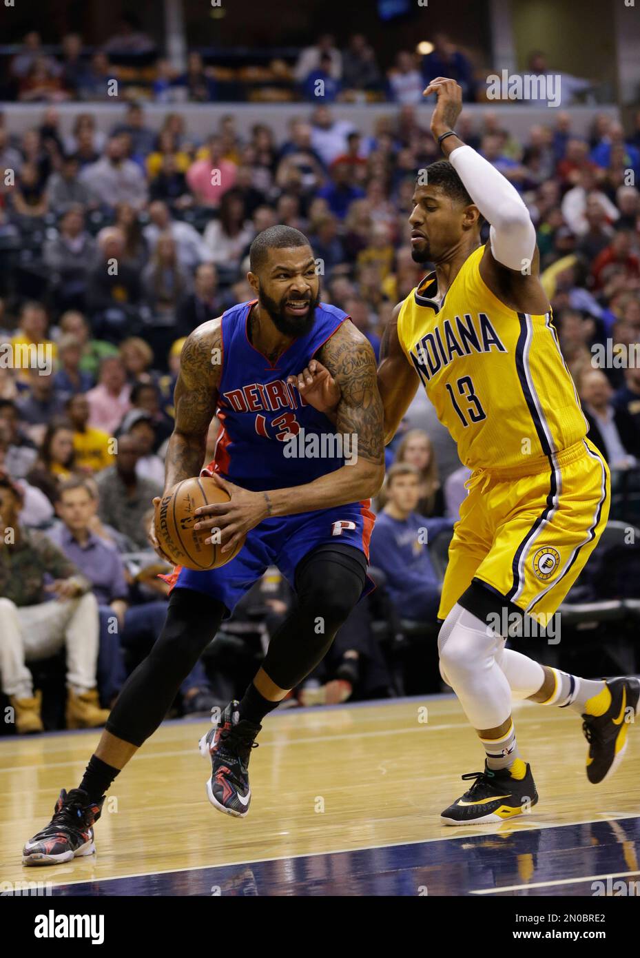 Detroit Pistons forward Marcus Morris, left, drives on Indiana Pacers ...