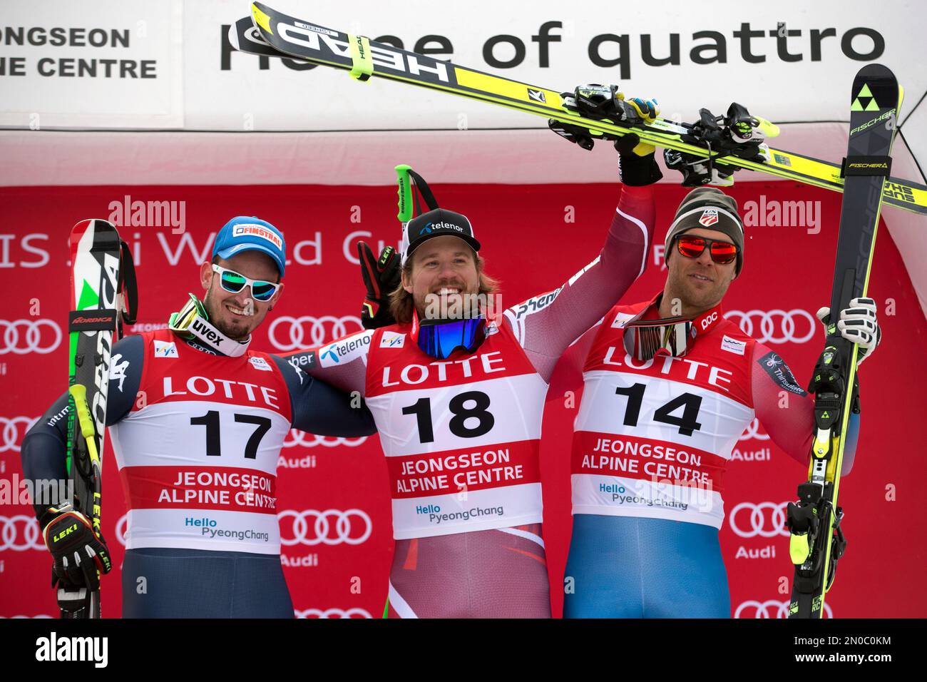 Runner-up Dominik Paris of Italy, left, winner Kjetil Jansrud of Norway ...