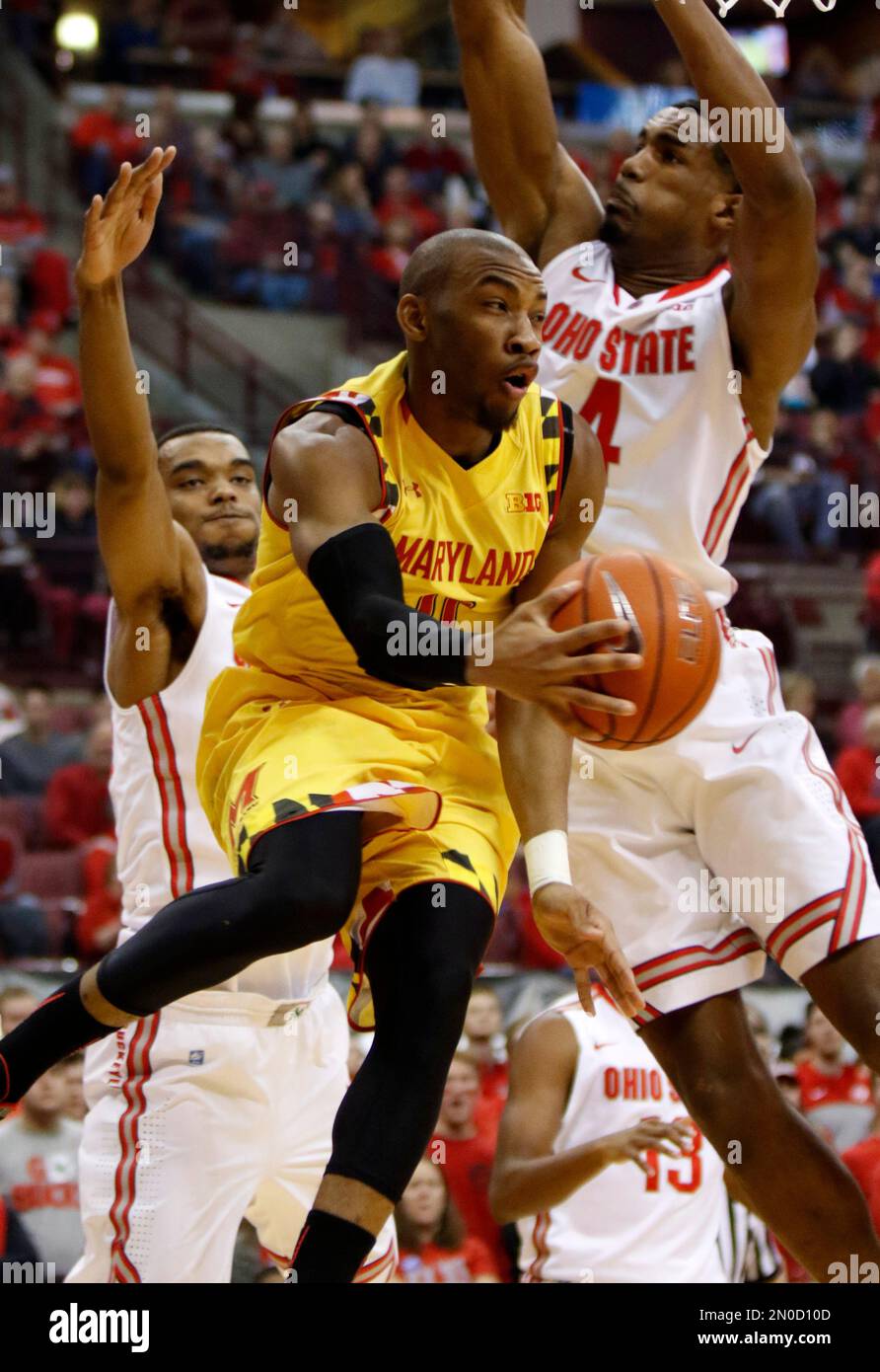 Maryland's Rasheed Sulaimon, center, passes the ball between Ohio State ...