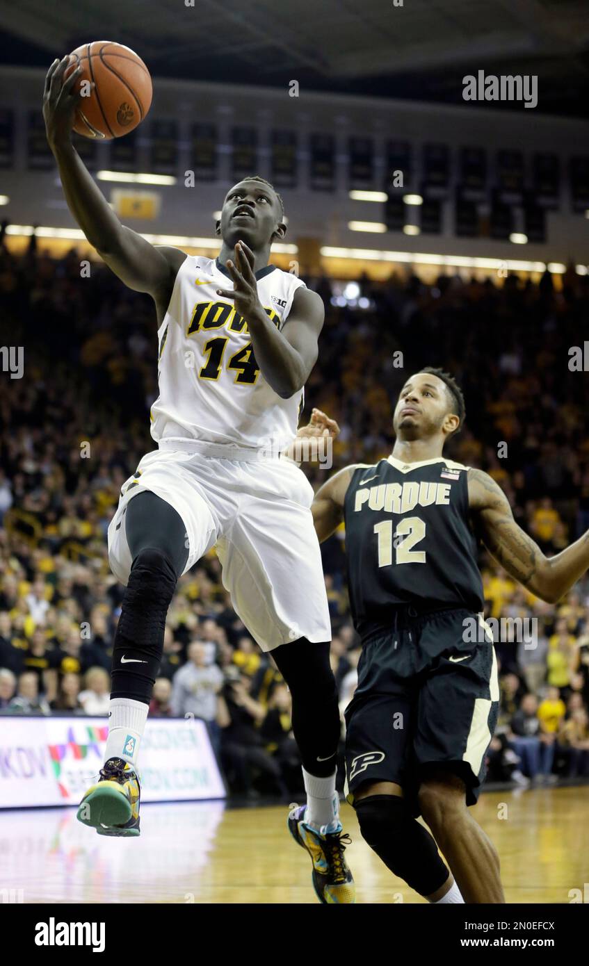 Iowa guard Peter Jok drives to the basket past Purdue forward Vince ...